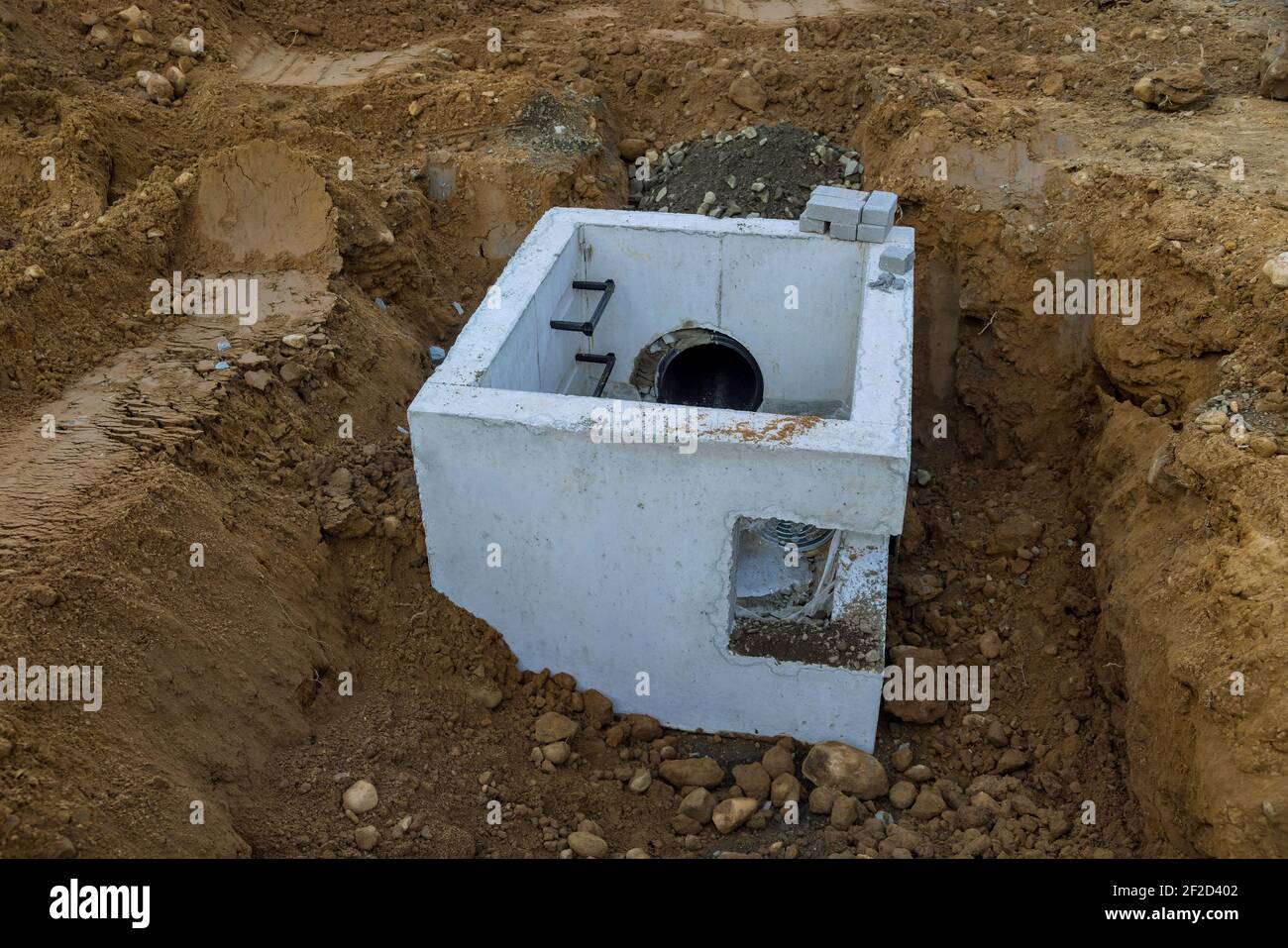 Worker construction excavation water drainage at road construction site ...