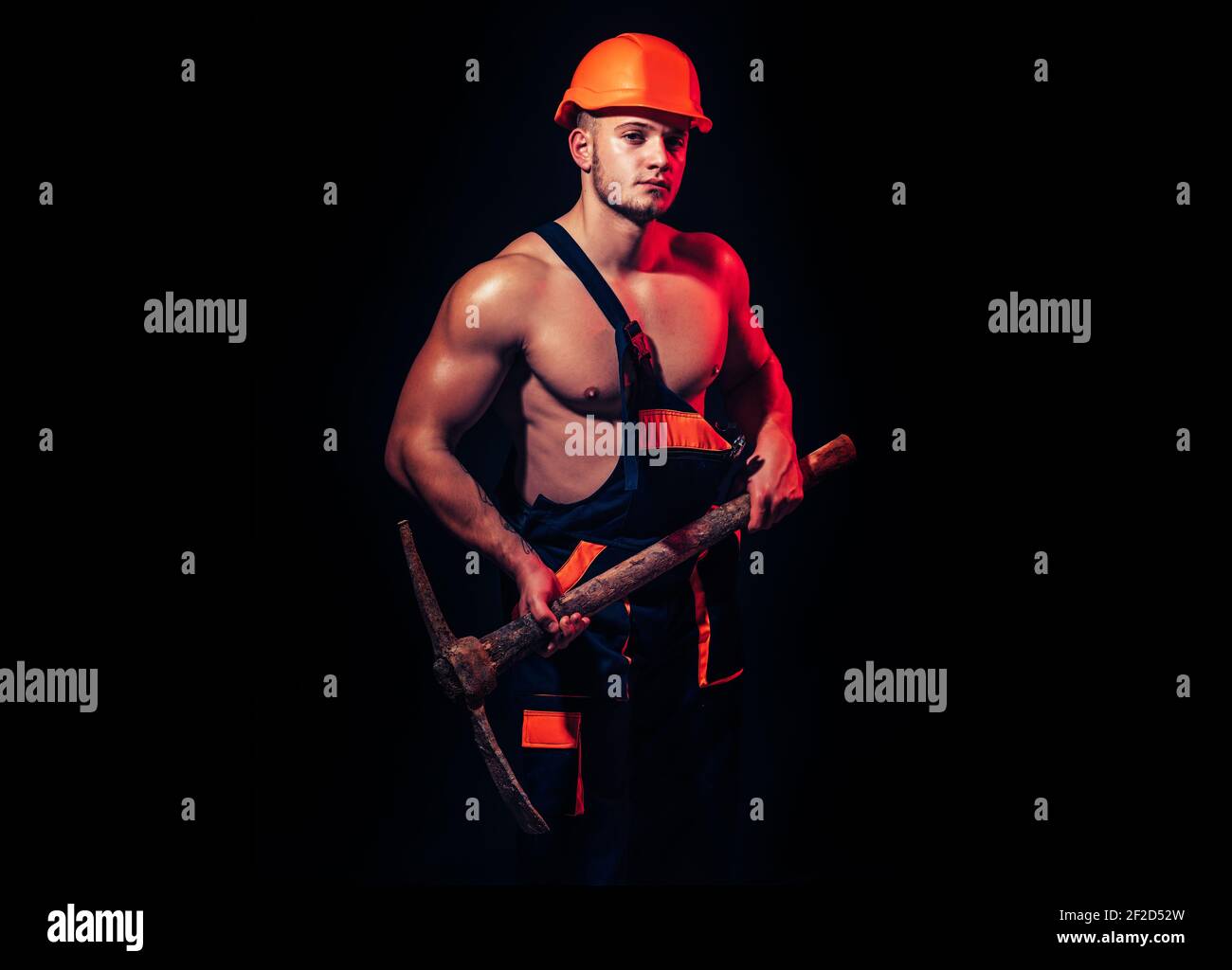 Guy under construction. Man miner with mining equipment. Muscular man ...