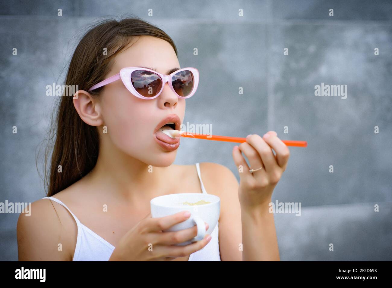 Woman drinking water through straw hi-res stock photography and images ...
