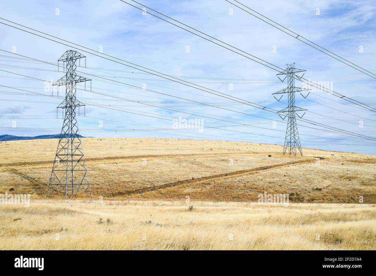 Power lines crossing above arid land in Kittitas County in Central ...