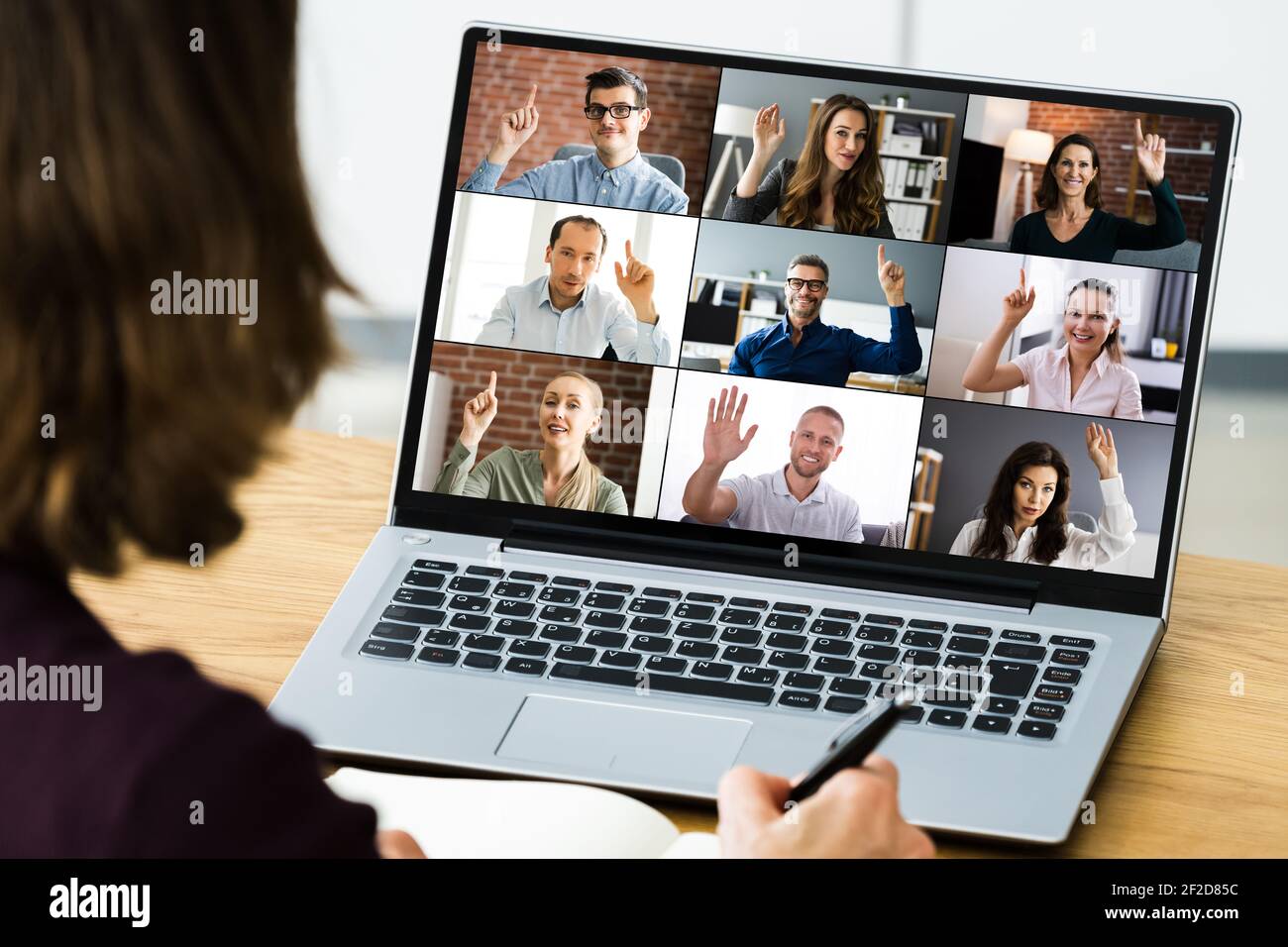 Video Conferencing Call Waving Hello With Hand Stock Photo - Alamy