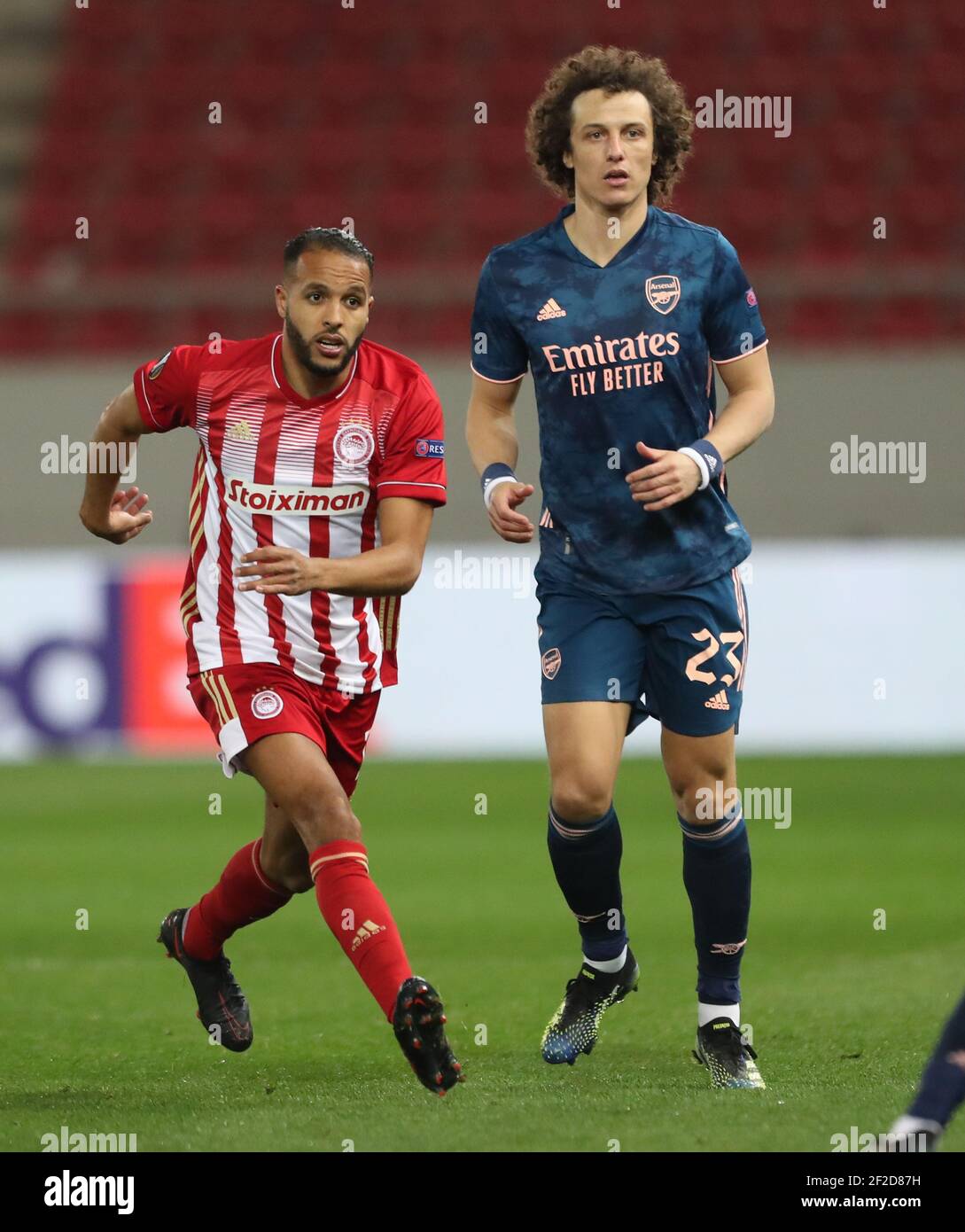 PIRAEUS, GREECE - MARCH 12: Youssef El Arabi of Olympiacos FC and David ...