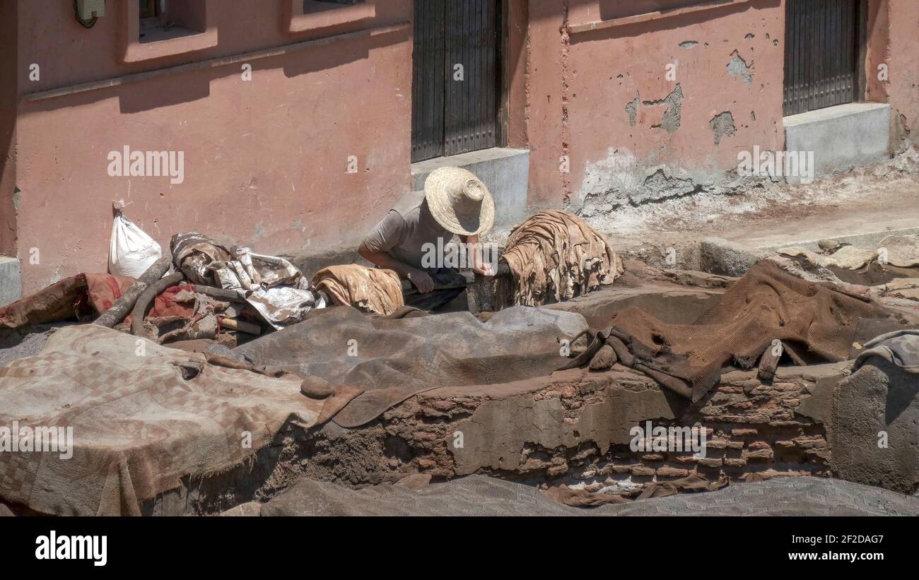 high shot of a tannery worker at one of the ancient tanneries in ...