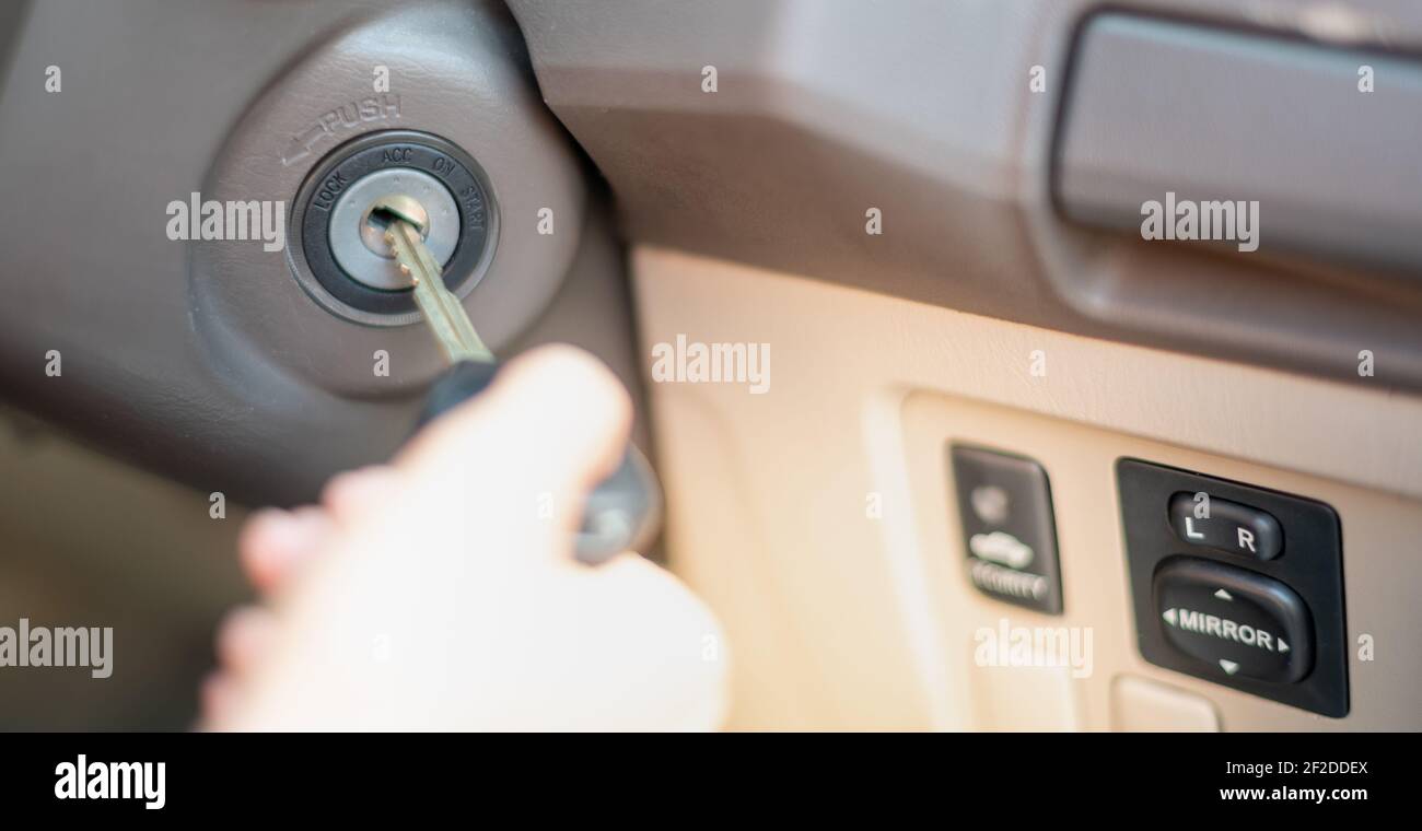Young woman is holding up a car key hi-res stock photography and images ...