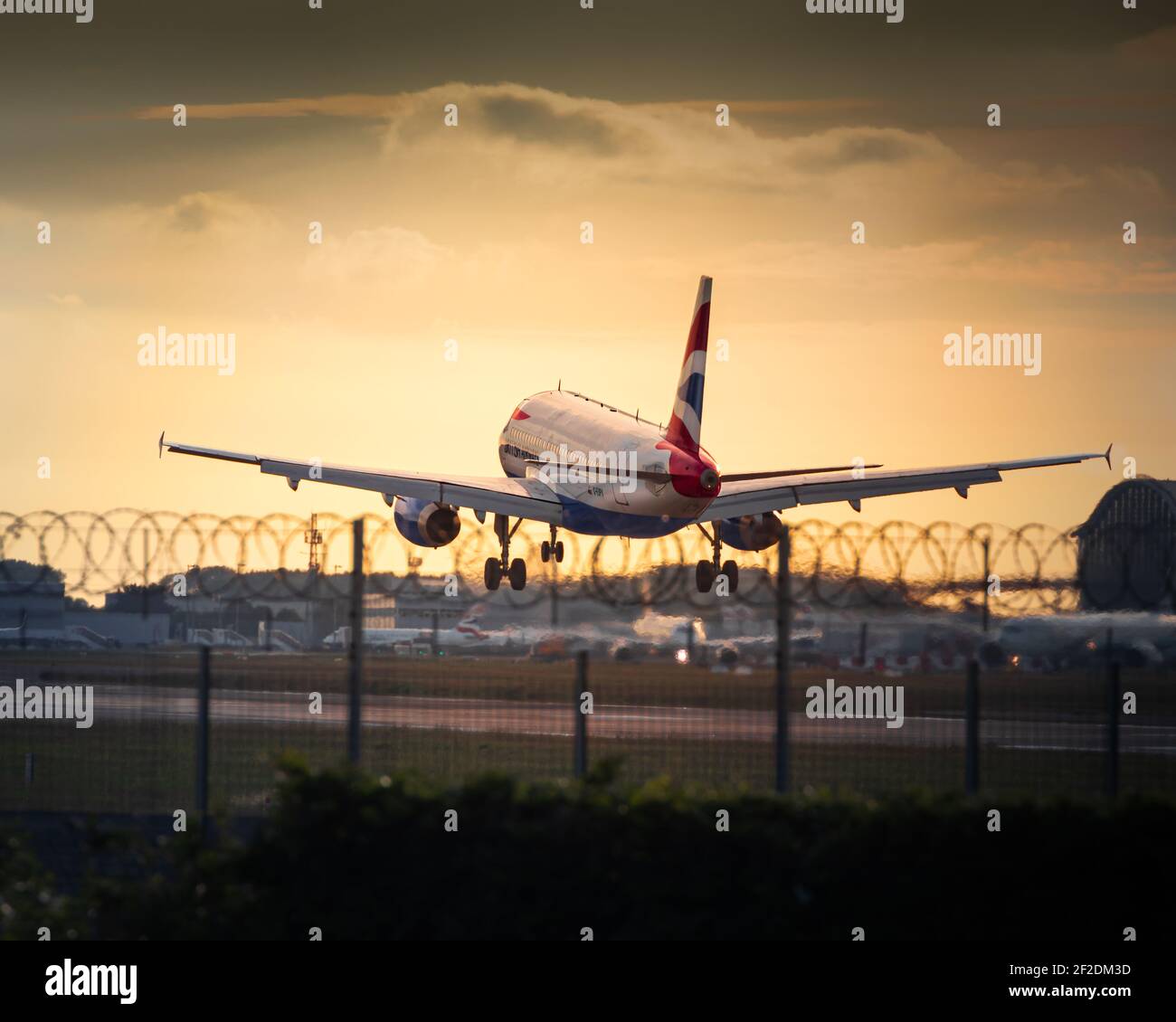 London, May 2020, UK, Airbus A319 coming in to land at sunset directly ...