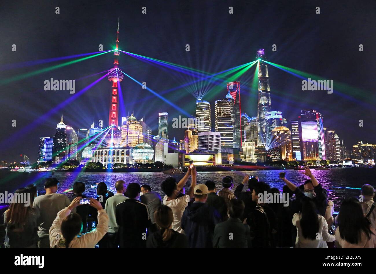SHANGHAI, CHINA - OCTOBER 7, 2020 - People enjoy a light show at night ...