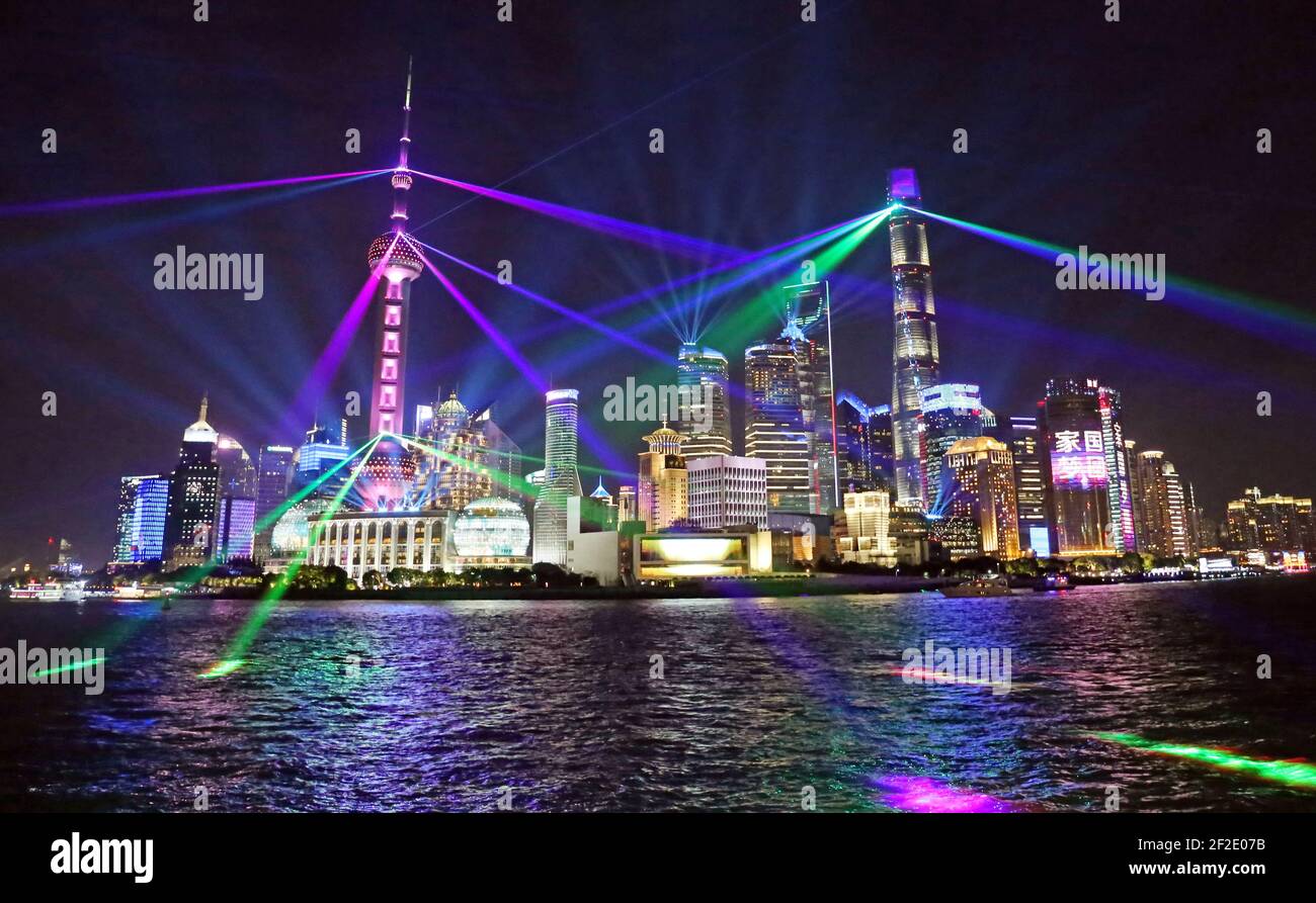 SHANGHAI, CHINA - OCTOBER 7, 2020 - People enjoy a light show at night ...