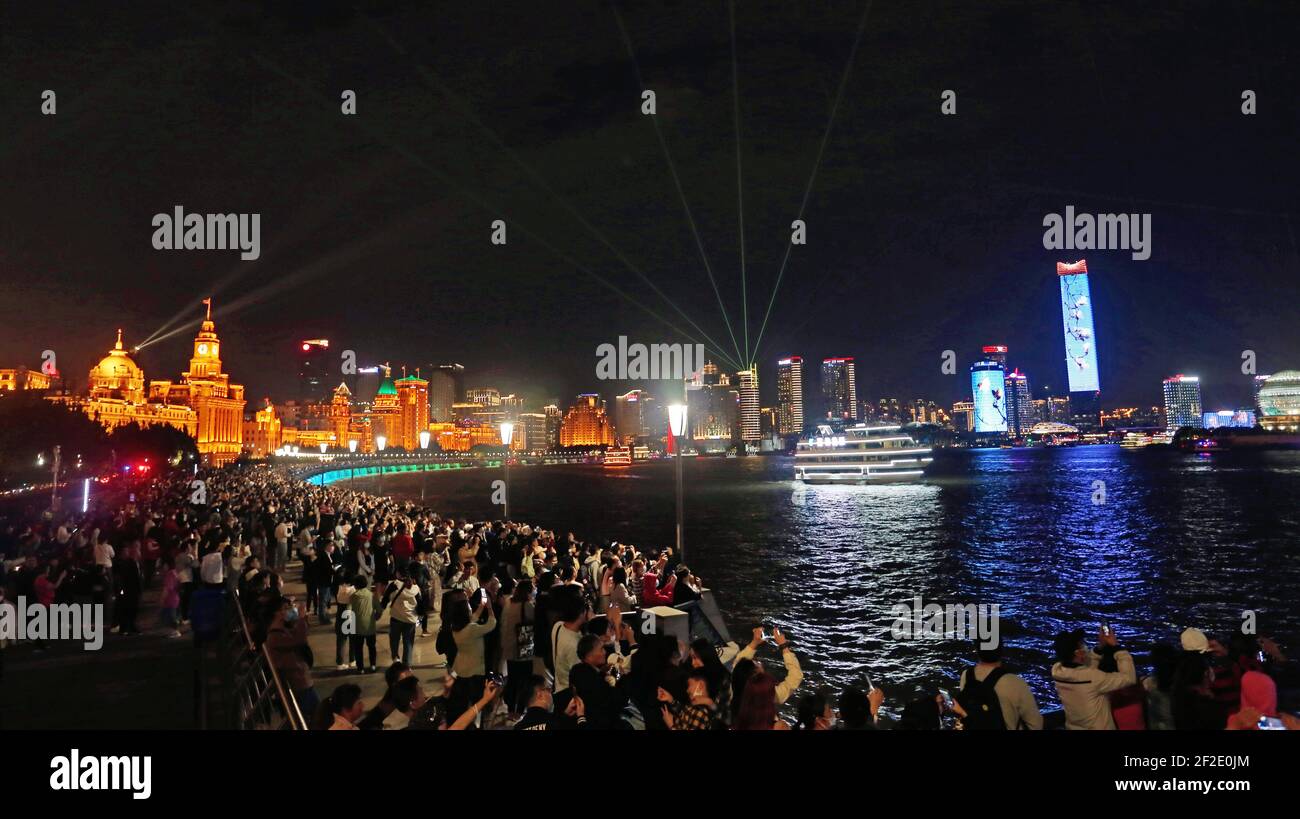 SHANGHAI, CHINA - OCTOBER 7, 2020 - People enjoy a light show at night ...