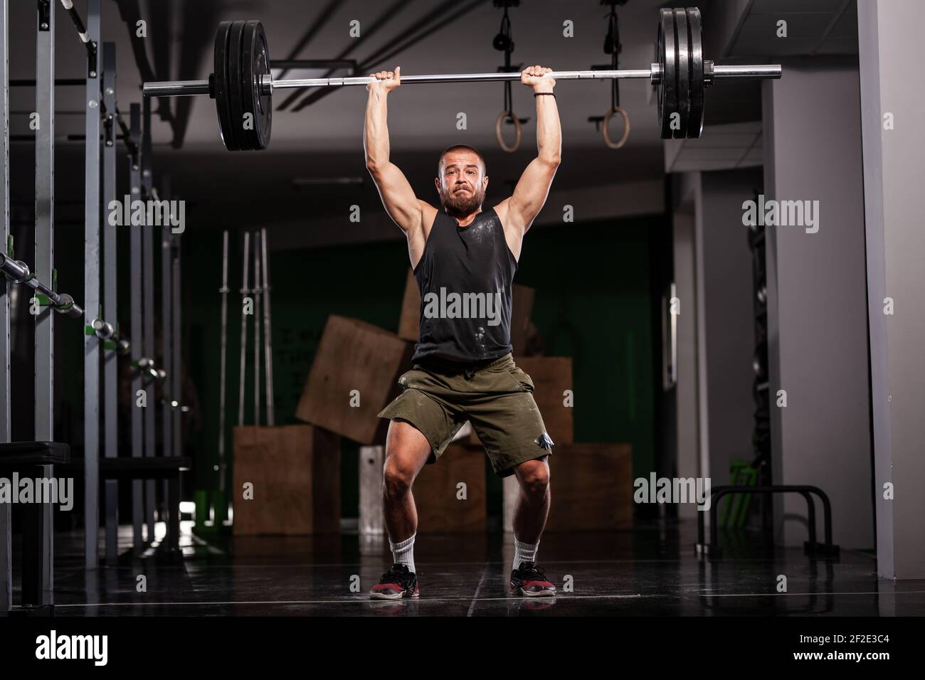Muscular athlete lifting very heavy barbell Stock Photo - Alamy