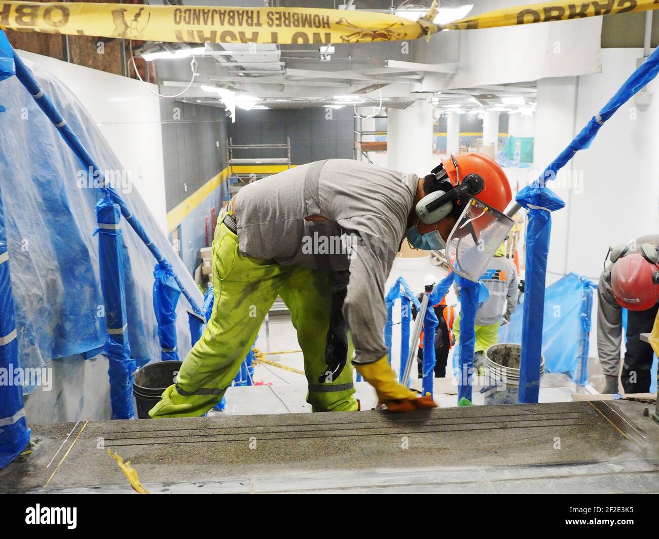 Construction workers in a subway station. The Lima City Metro Line 2 ...