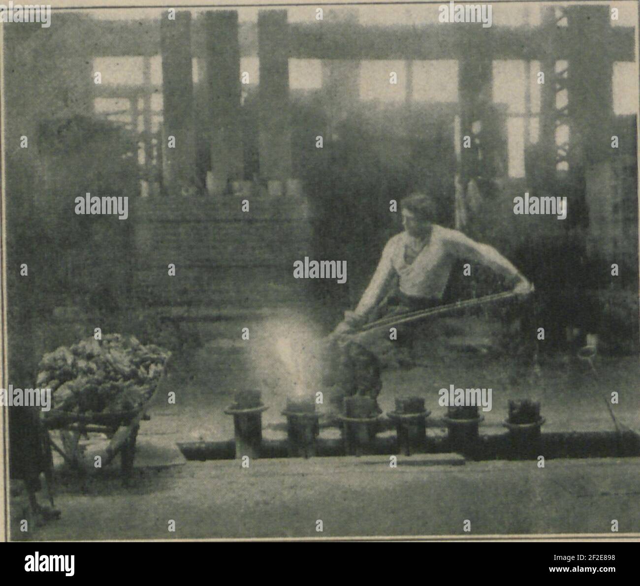 Pouring molten metal from the crucible pot into the ingot moulds, (HS85 ...