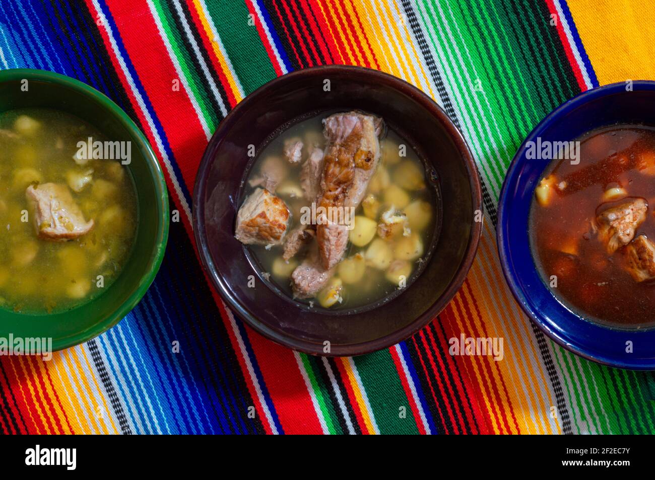White, green and red pozole. Mexican pork and hominy corn stew Stock ...