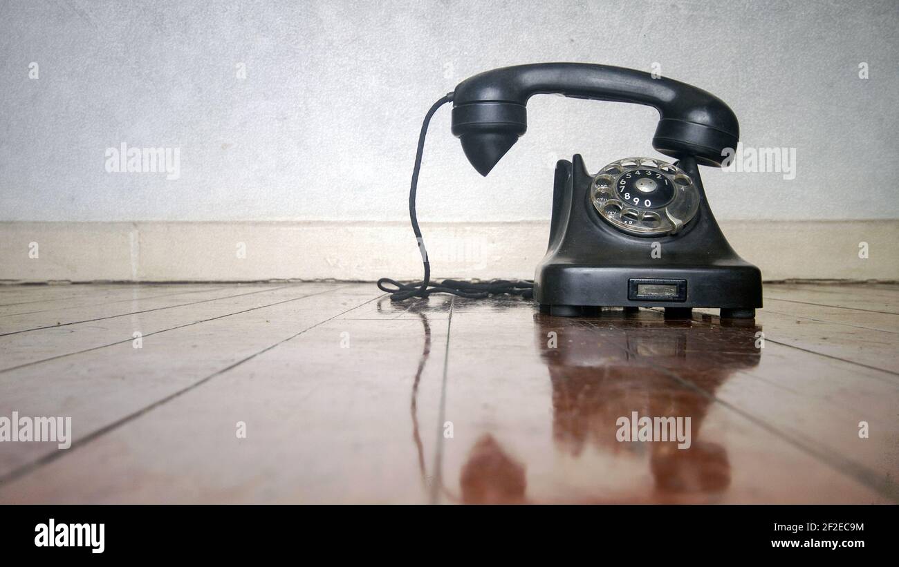 vintage black phone ringing on a wooden floor with copy space Stock ...