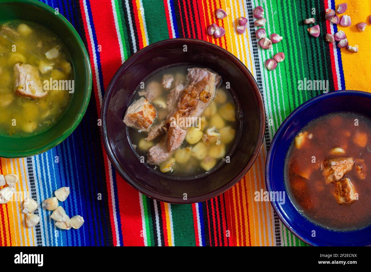 White, green and red pozole. Mexican pork and hominy corn stew Stock ...