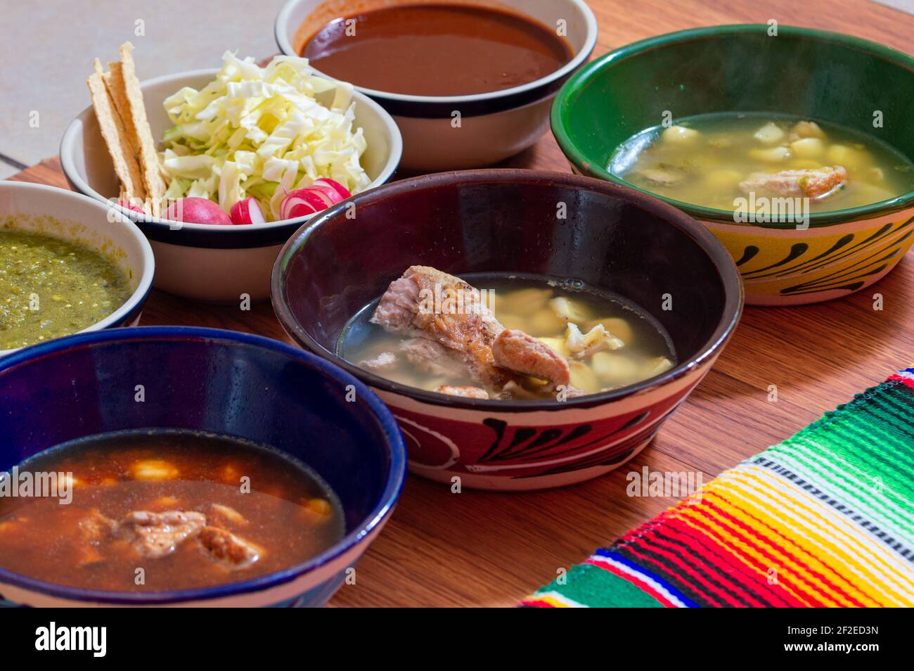 White, green and red pozole. Mexican pork and hominy corn stew Stock ...