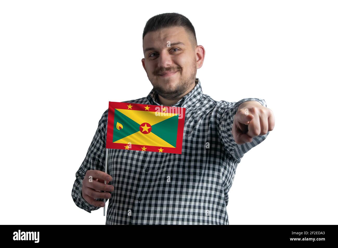 White guy holding a flag of Grenada and points forward in front of him ...