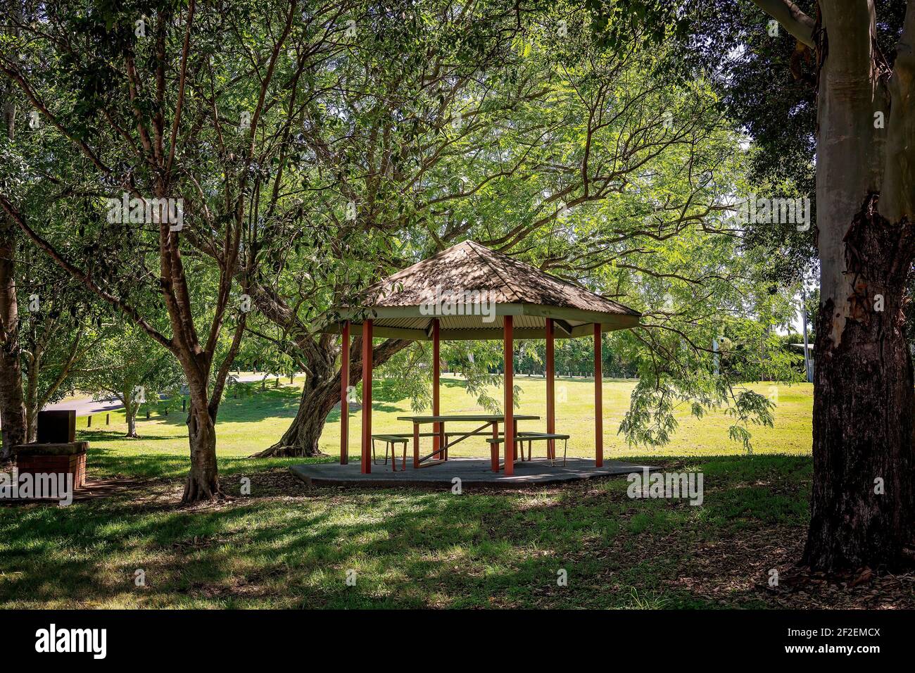 A picnic shade structure with barbecue in a public outdoor park Stock ...