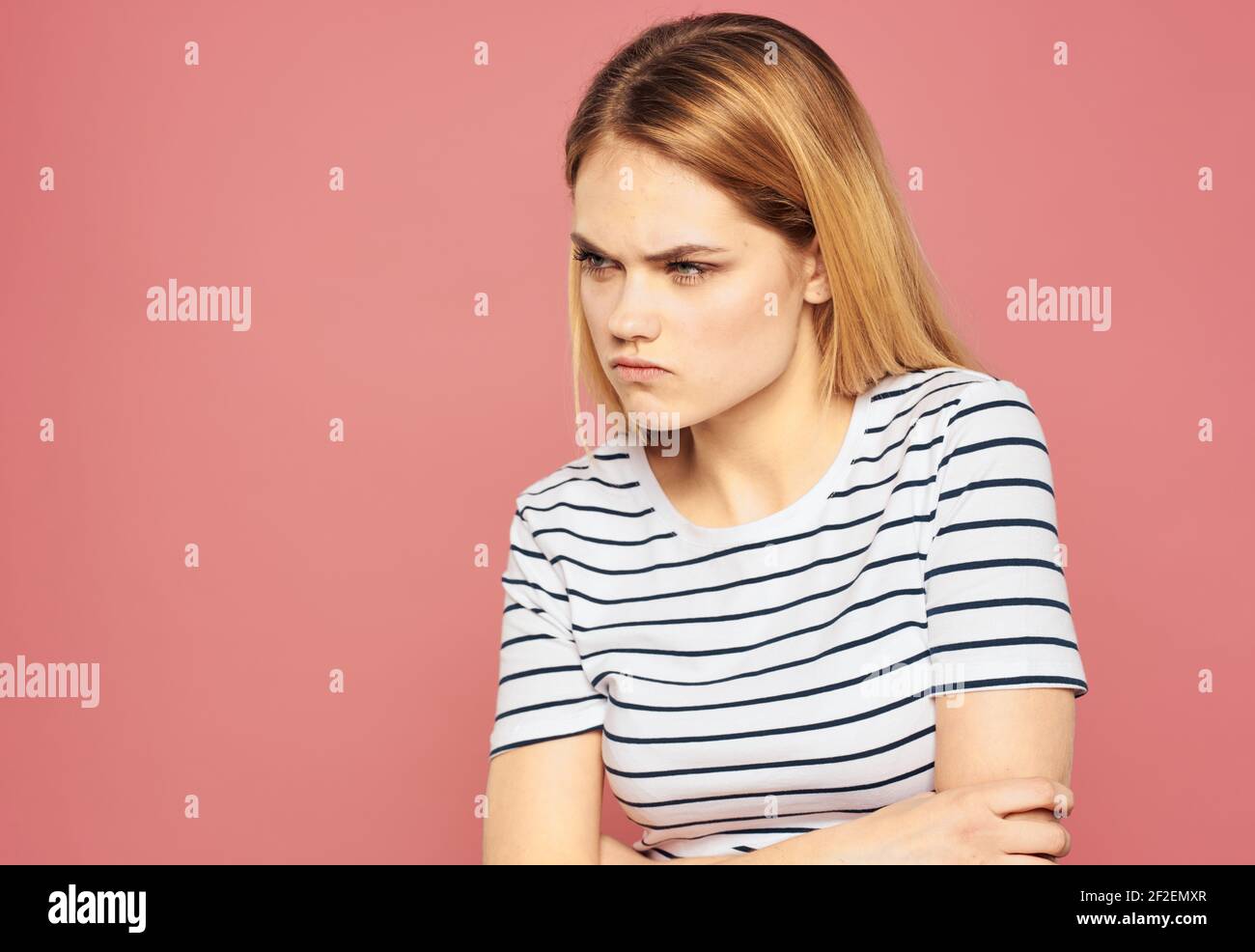 Upset woman offended face pink background cropped view model Stock ...