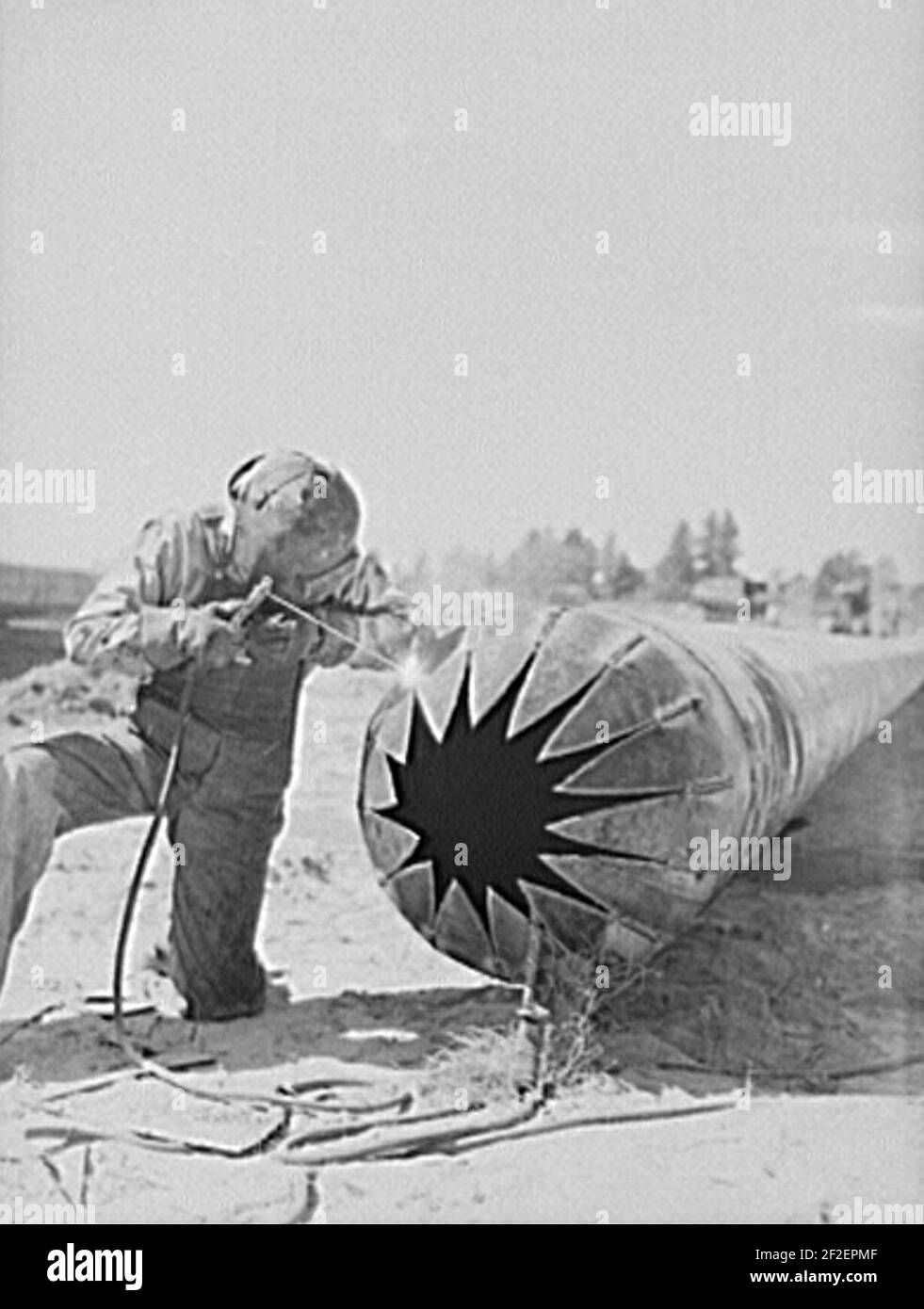 Preparing section of Big Inch pipeline to go under railroad Stock Photo ...