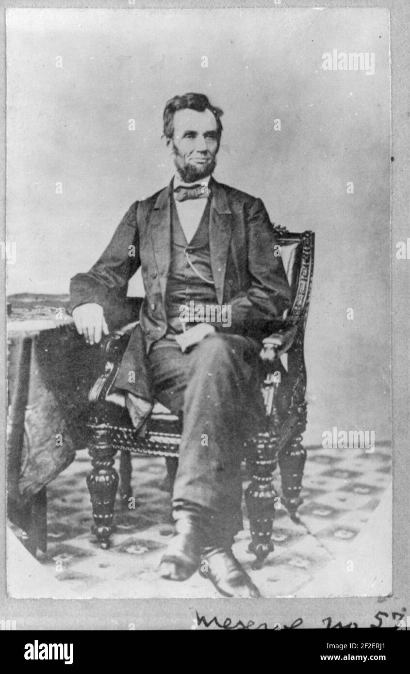 President Abraham Lincoln, full-length portrait, seated and facing ...