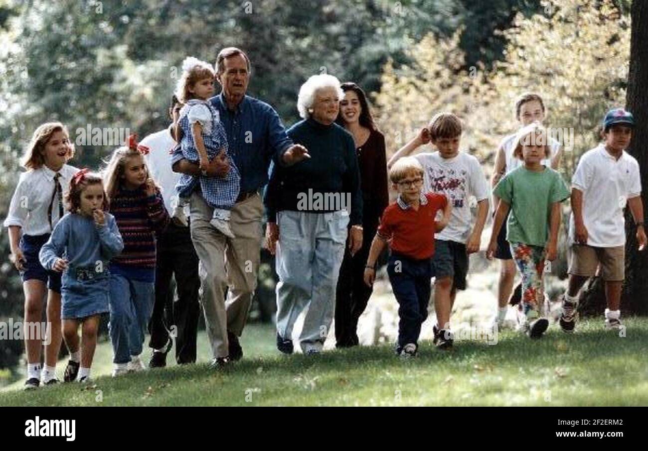 President and Mrs. Bush walk with their grandchildren at Camp David ...