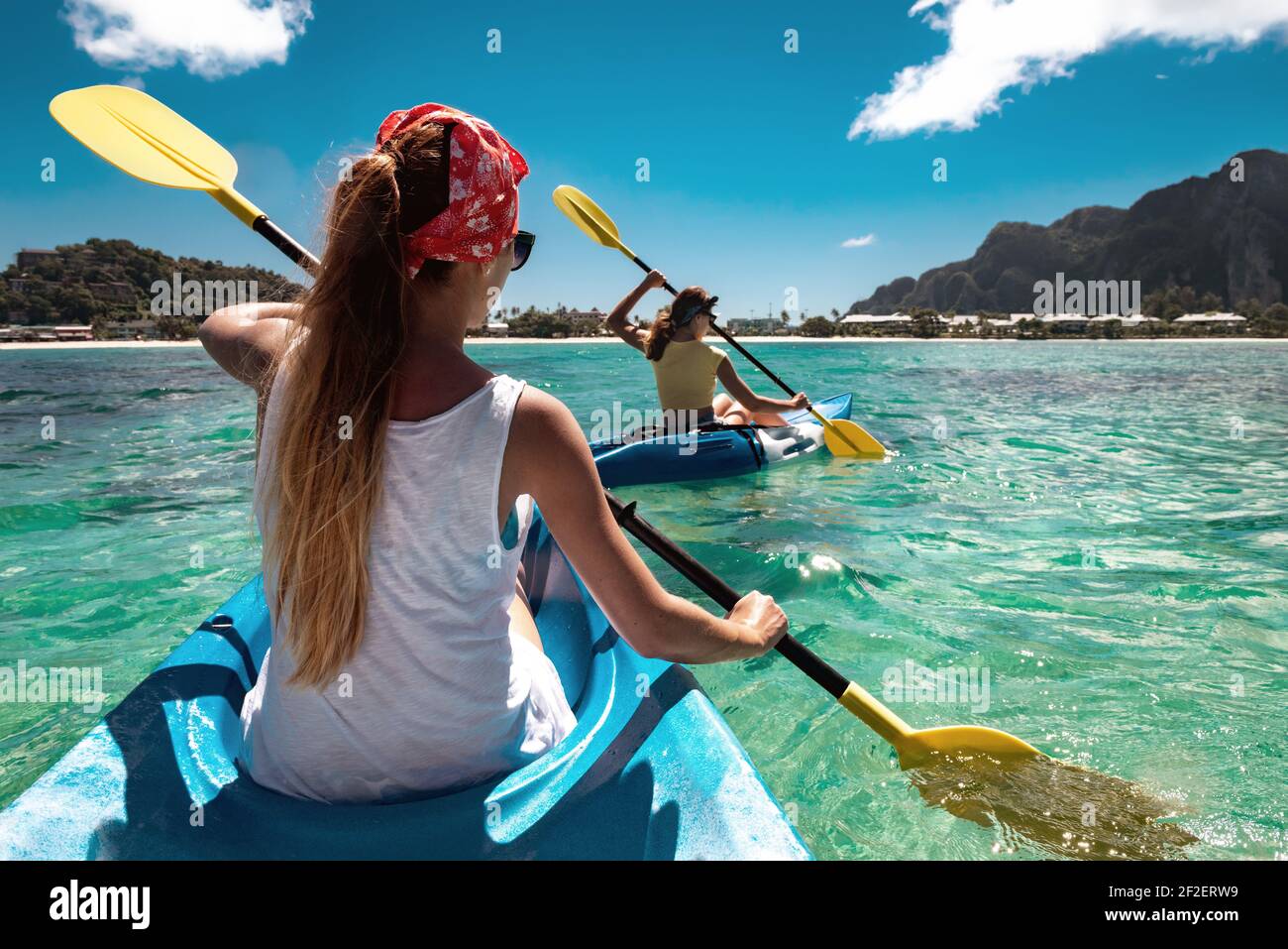 Girls paddling canoes hi-res stock photography and images - Alamy