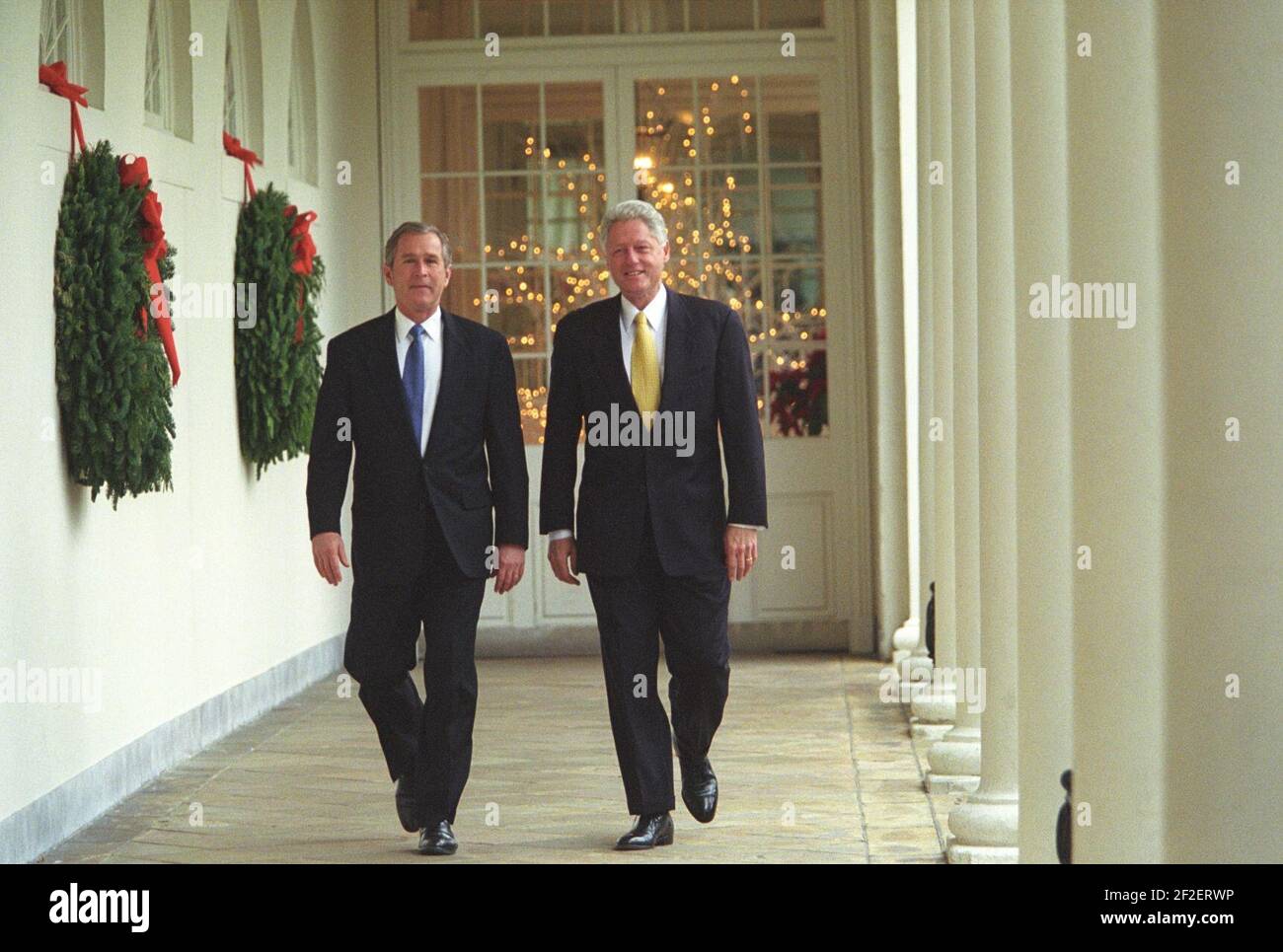 President Bill Clinton and President-Elect George W. Bush walk along ...
