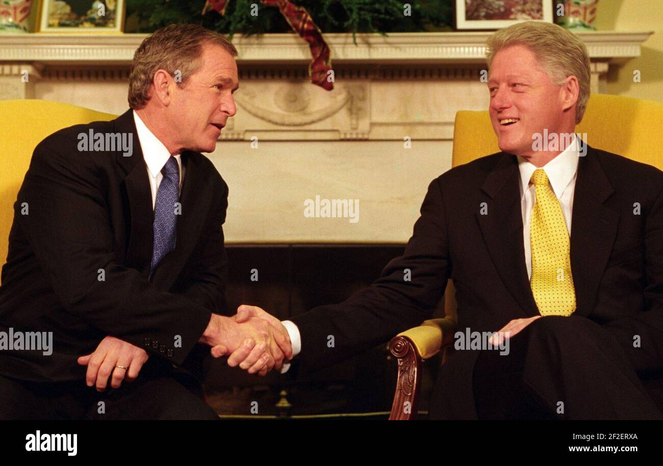 President Bill Clinton and President-Elect George W. Bush shake hands ...