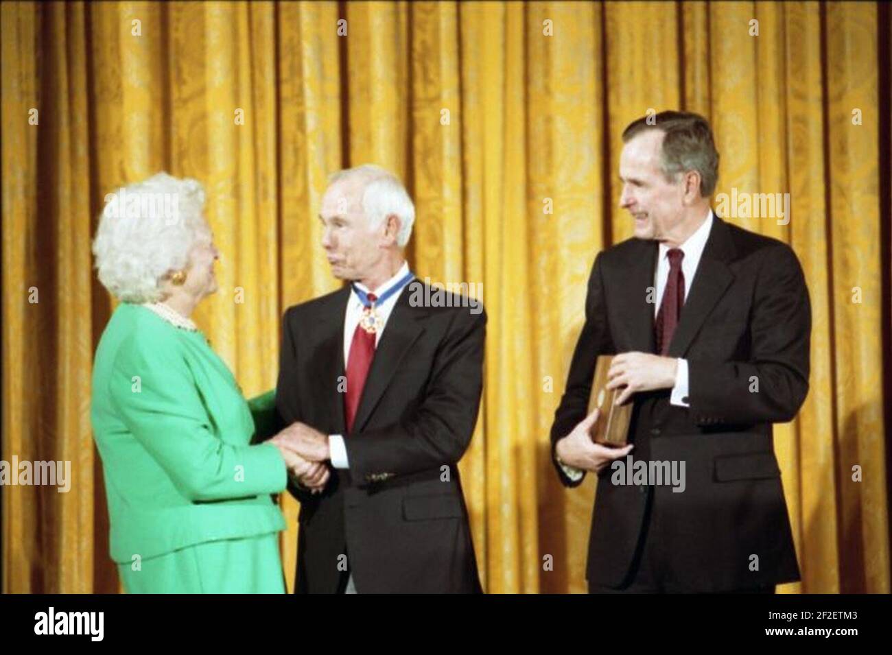 President George H. W. Bush and Mrs. Barbara Bush award the ...