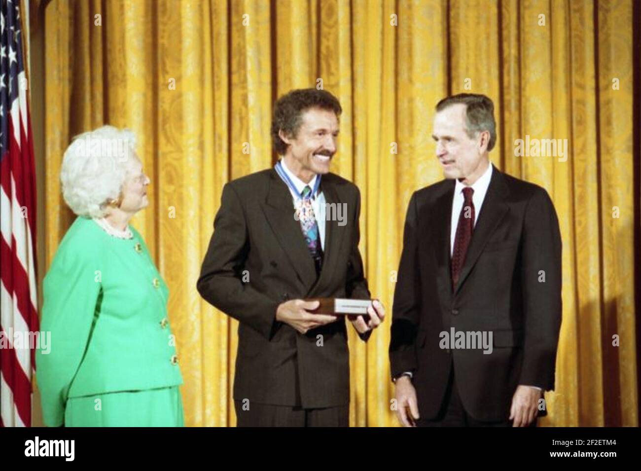 President George H. W. Bush and Mrs. Barbara Bush award the ...