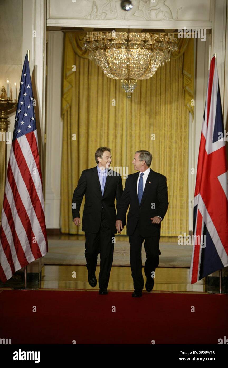 President George W. Bush and British Prime Minister Tony Blair walk ...
