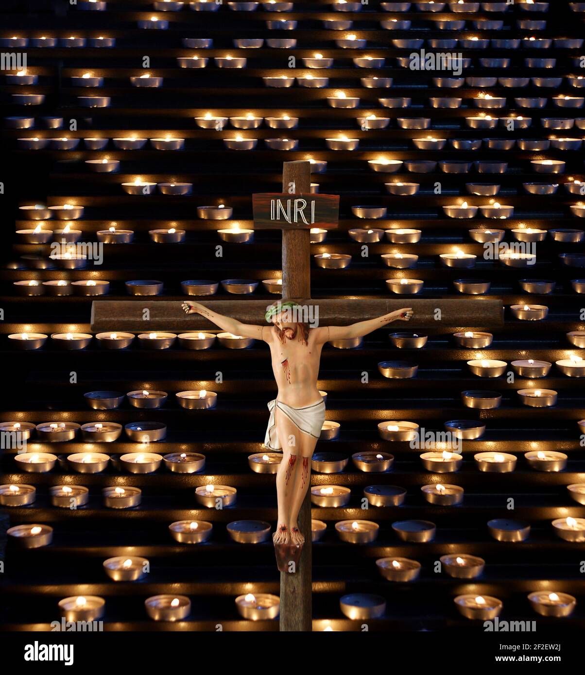 Jesus Crucifixion against the background of church candles Stock Photo ...