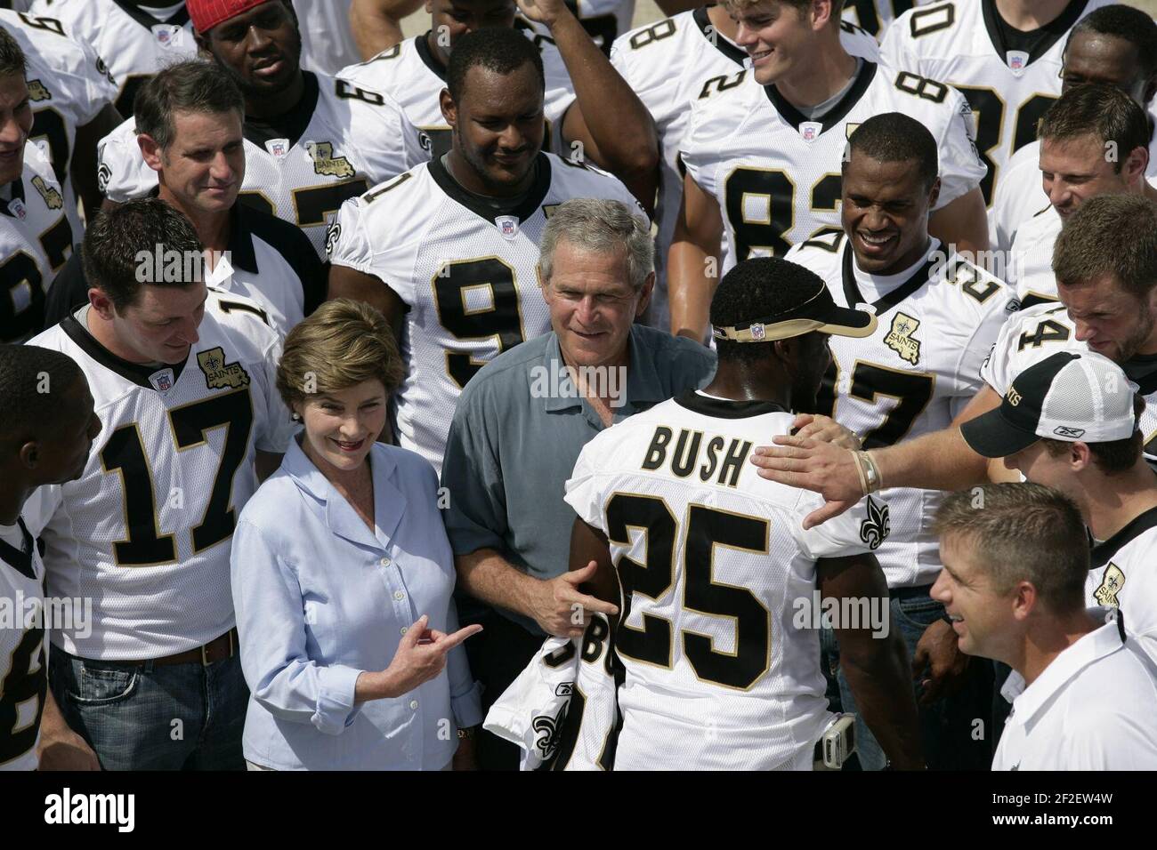 President George W. Bush and Laura Bush are Surrounded by Members of ...