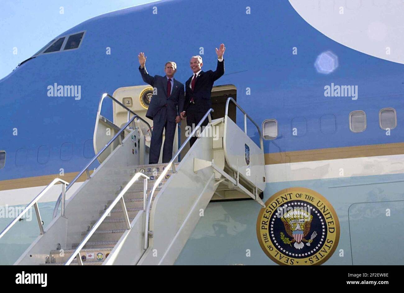 President George W. Bush and Representative Bob Beauprez wave for the ...