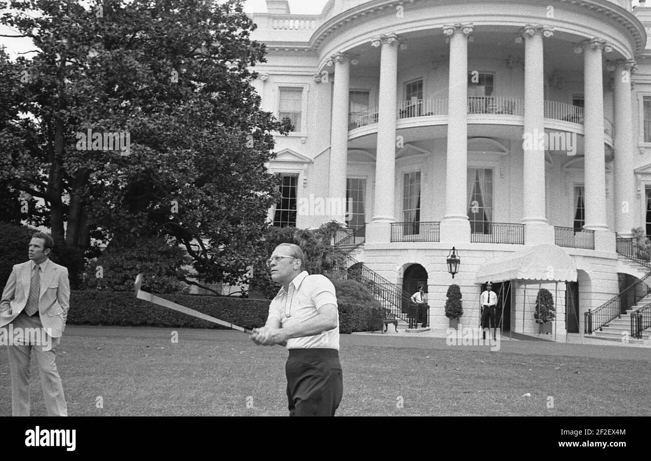 President Gerald Ford practices golf under the watchful eye of the ...