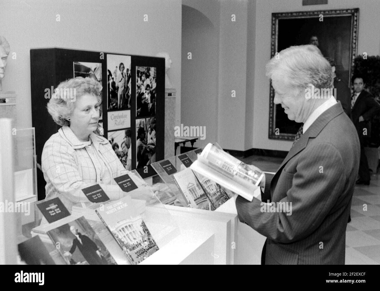 President Jimmy Carter at White House Visitors Desk Looking at Guide ...