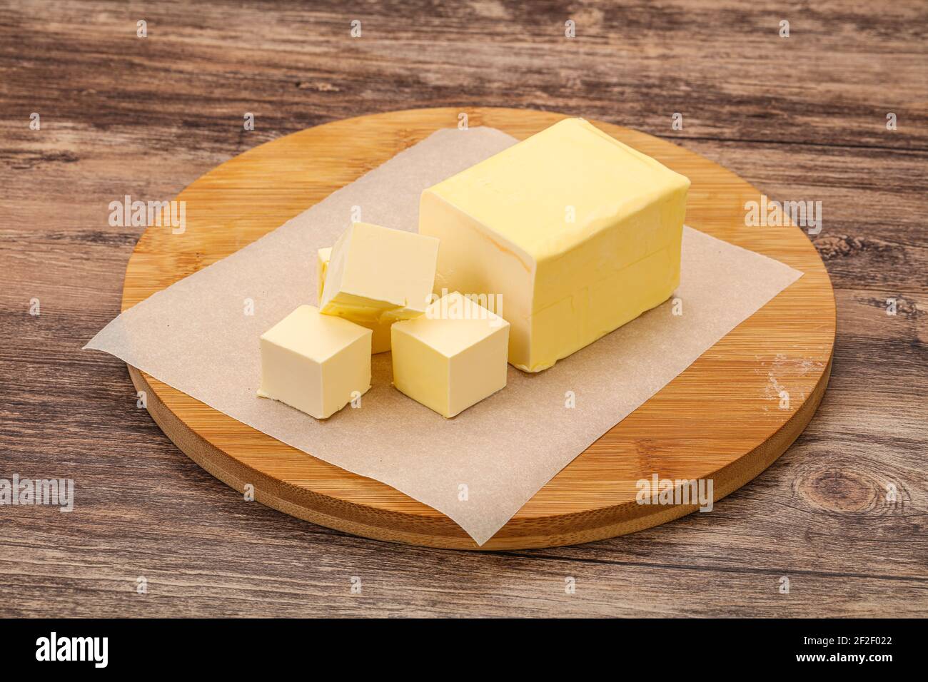 Dairy natural yellow butter piece over board Stock Photo - Alamy
