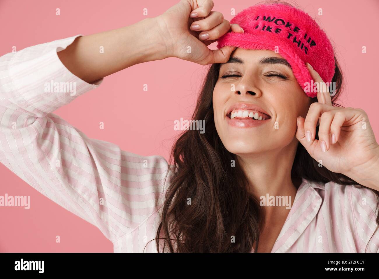 Happy beautiful woman laughing while posing in sleeping mask isolated ...