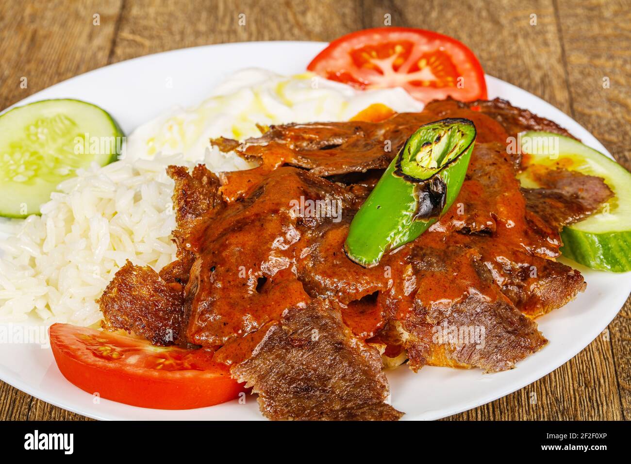 Turkish cuisine - Iskander kebab grilled meat with sauce Stock Photo ...