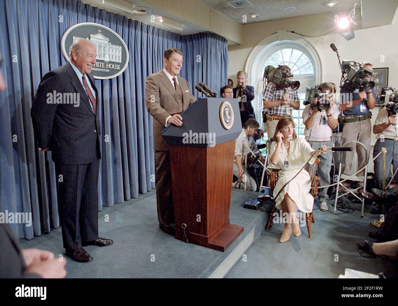 President Ronald Reagan and George Shultz giving a statement on the US ...