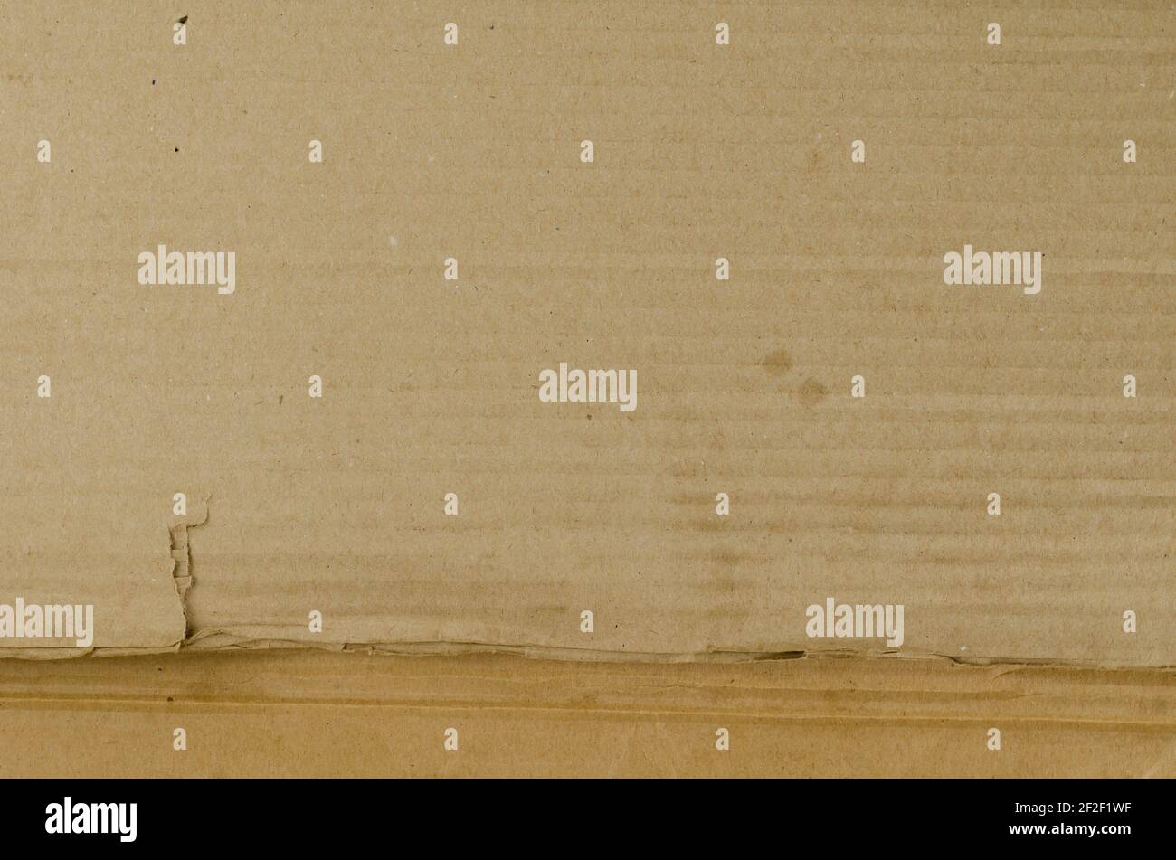 Dirty corrugated cardboard. Old, torn cardboard with streaks and stains ...