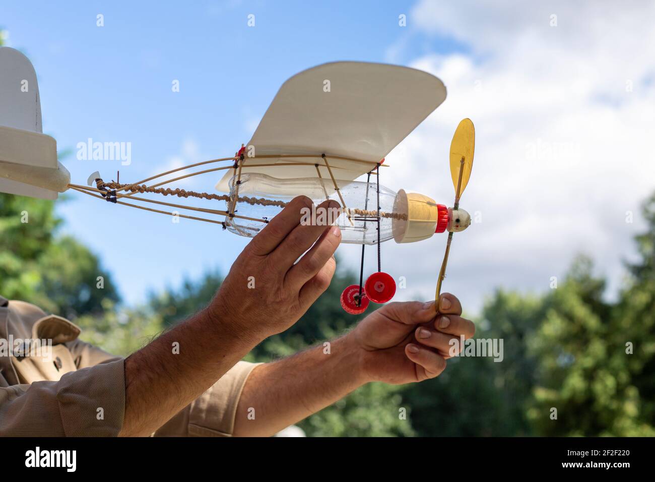 Airplane model with a propeller made from household waste plastic on a ...