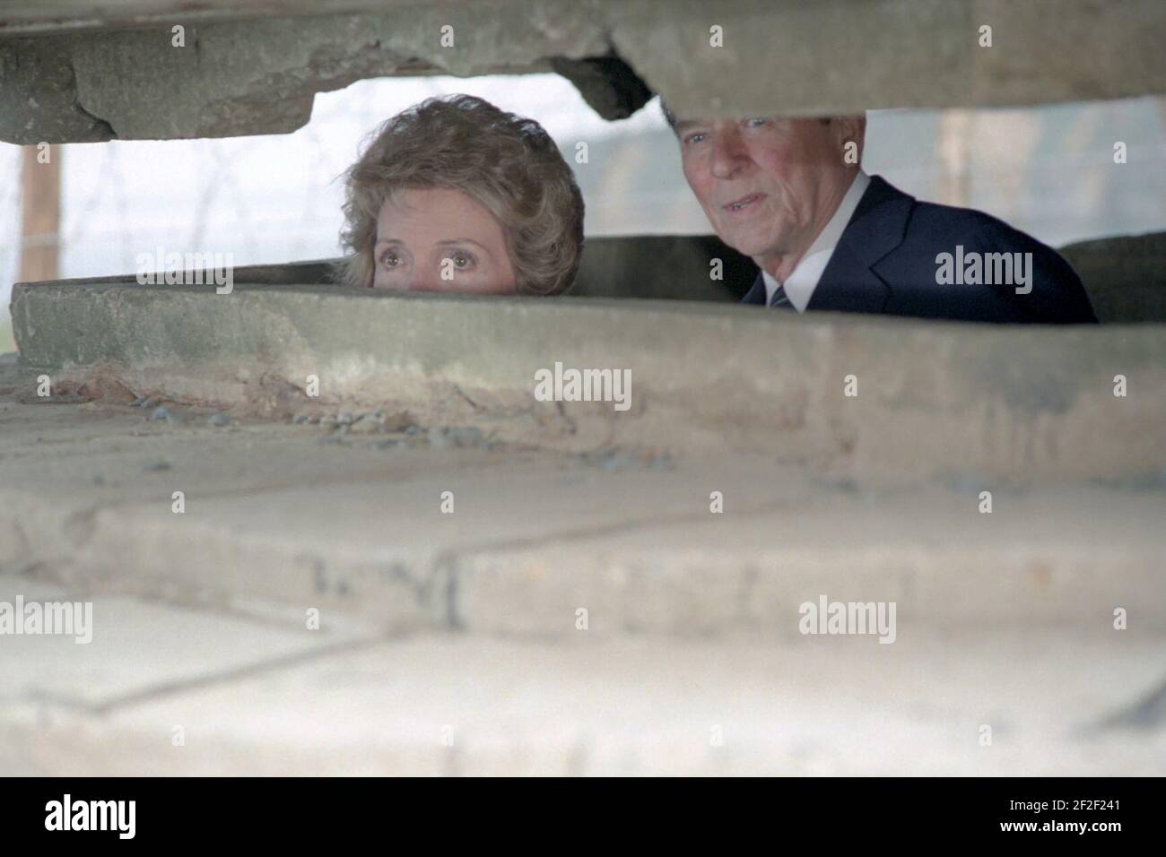 President Ronald Reagan and Nancy Reagan touring the area gun ...