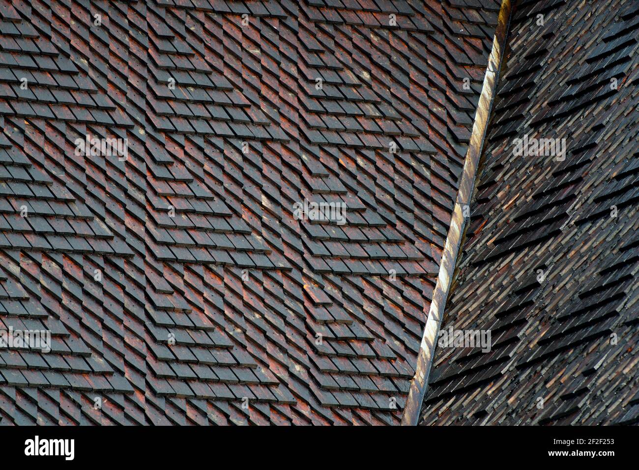 Rectangular wooden roof tiles shingles on old conservation building ...