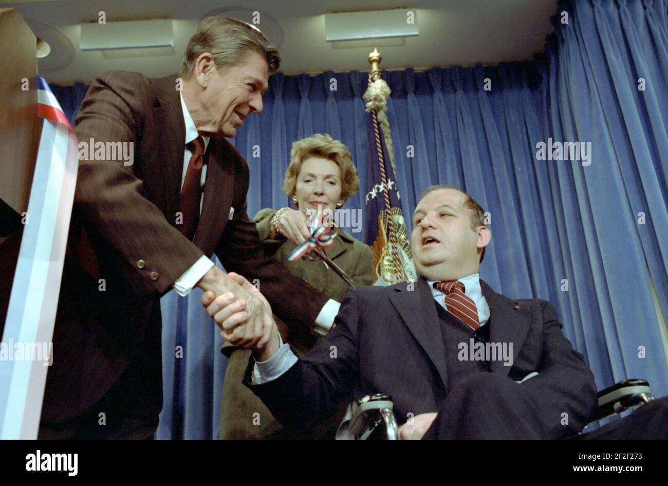 President Ronald Reagan and Nancy Reagan with James Brady at a Ceremony ...