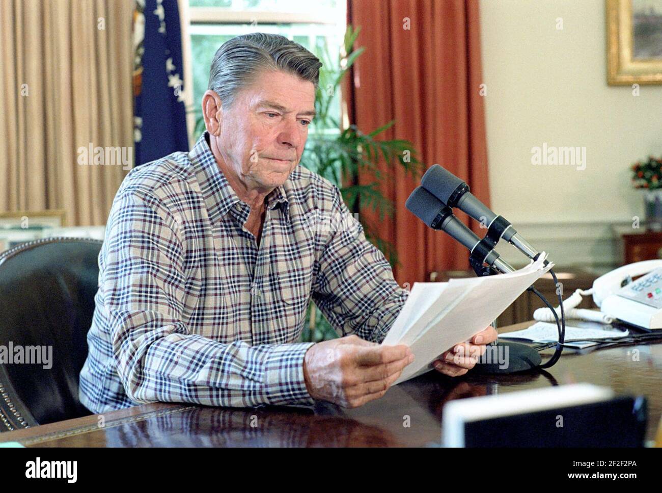 President Ronald Reagan during his Saturday Radio Address in the Oval ...