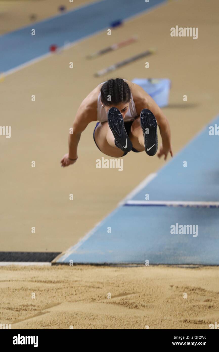 ISTANBUL, TURKEY - JANUARY 31, 2021: Undefined athlete long jumping ...