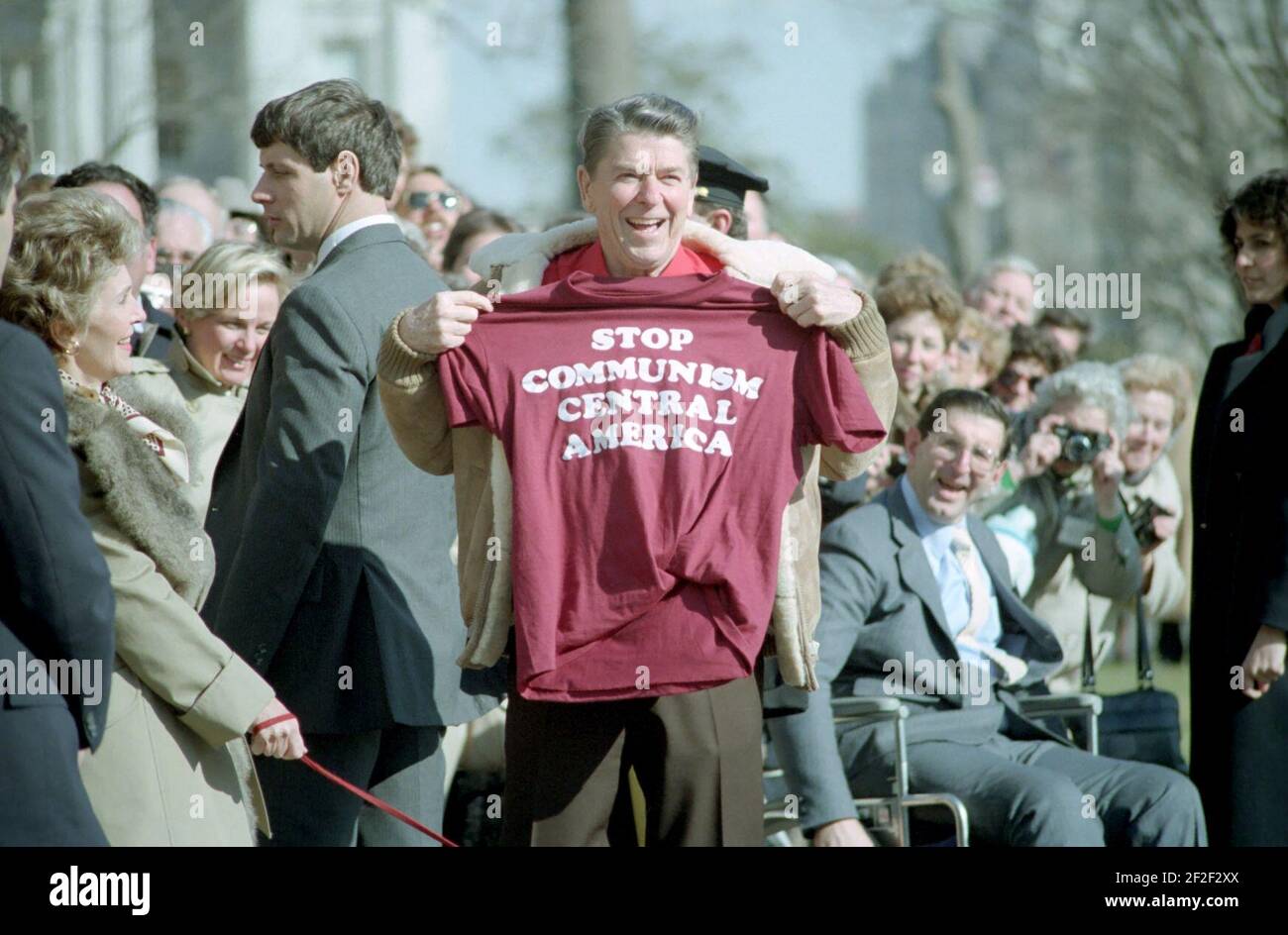 President Ronald Reagan holding a Stop Communism T-Shirt Stock Photo ...