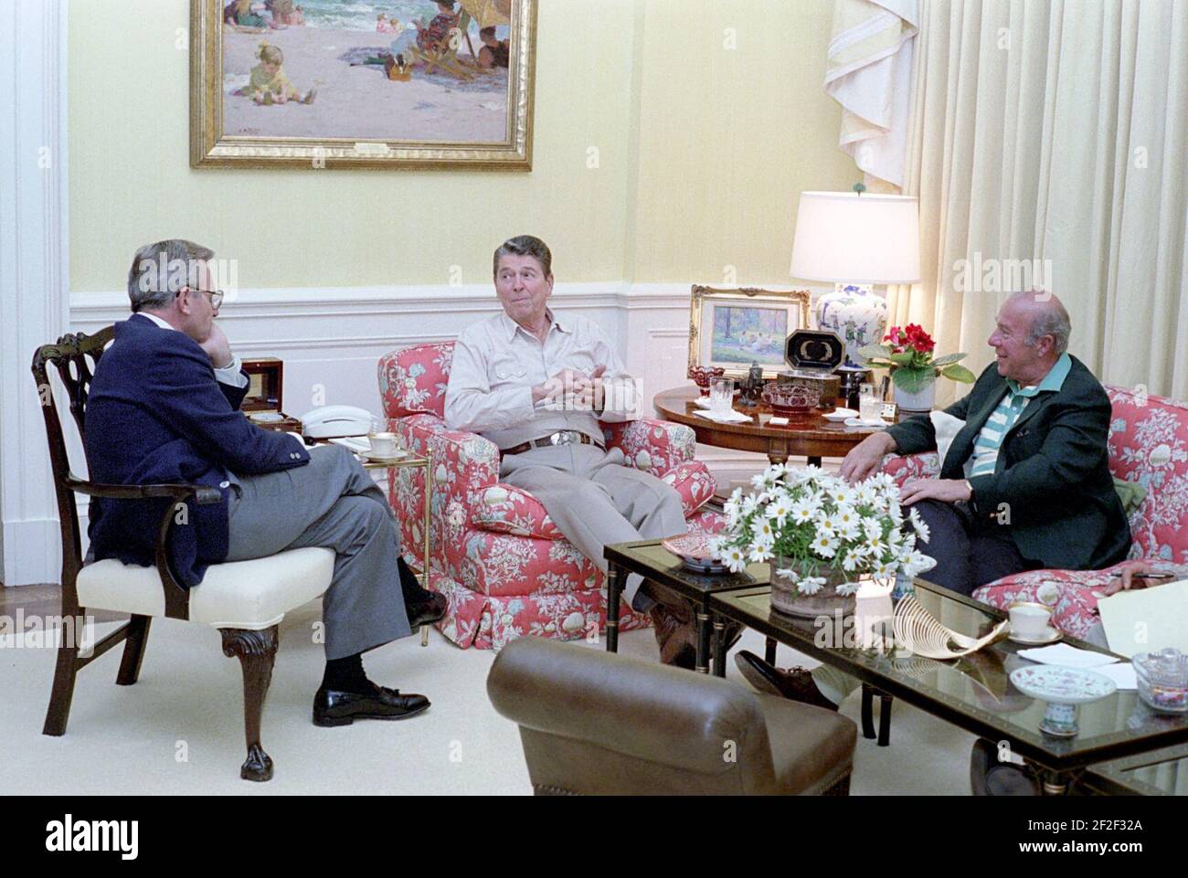President Ronald Reagan meeting with George Shultz and Frank Carlucci ...