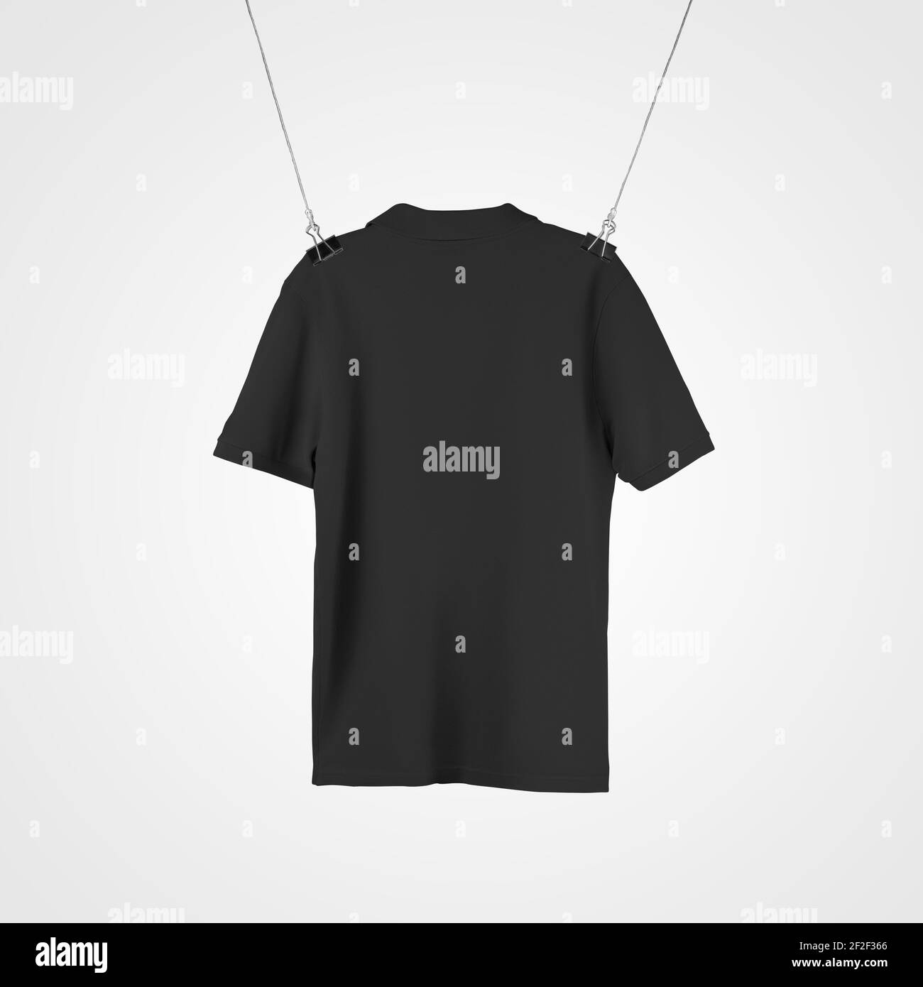 Mockup of black casual polo hanging from ropes for design presentation ...
